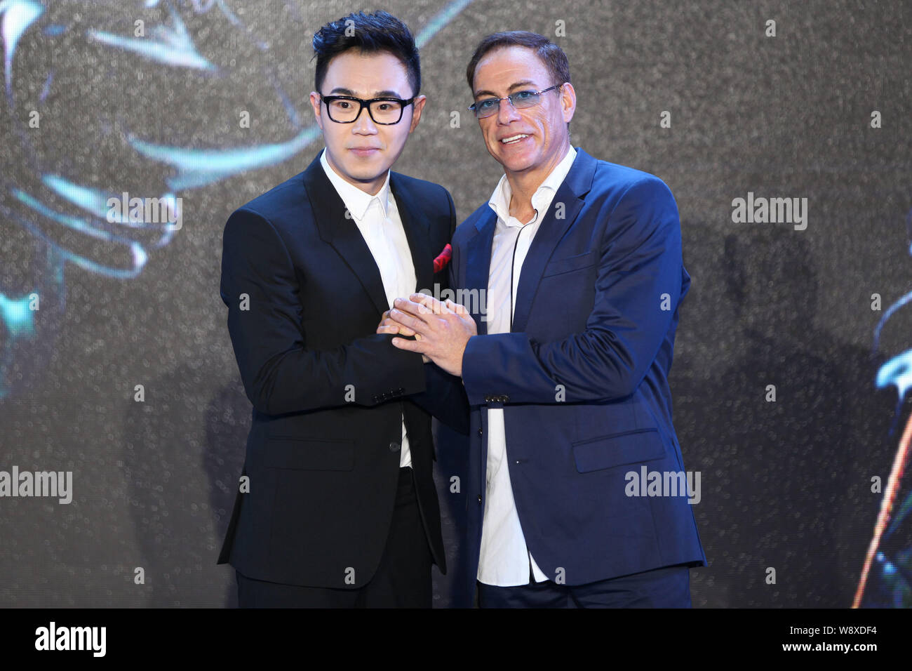U.S. Hollywood action star Jean-Claude Van Damme, right, poses during a ...