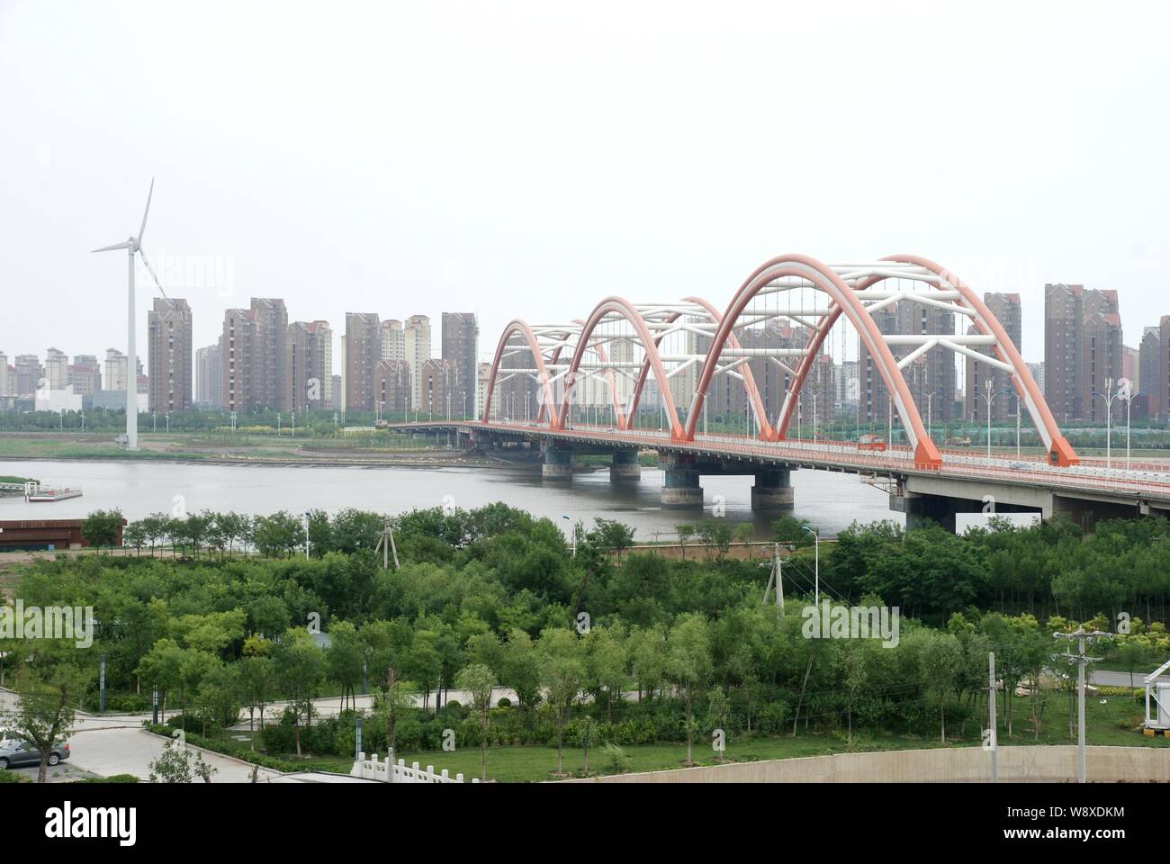 --FILE--Vehicles travel through the nearly empty bridge connecting the ...