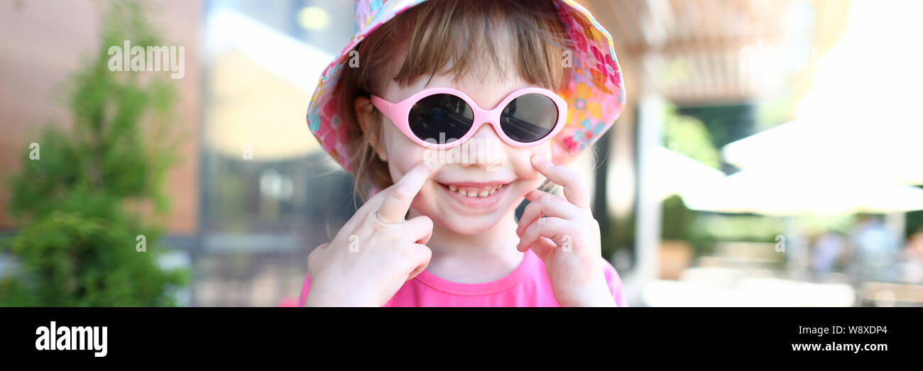 Happy smiling girl child in sunglasses outdoor portrait Stock Photo - Alamy