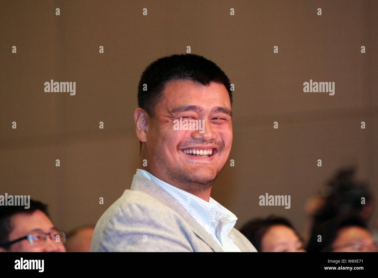 Former NBA basketball player Yao Ming smiles during a ceremony for ...