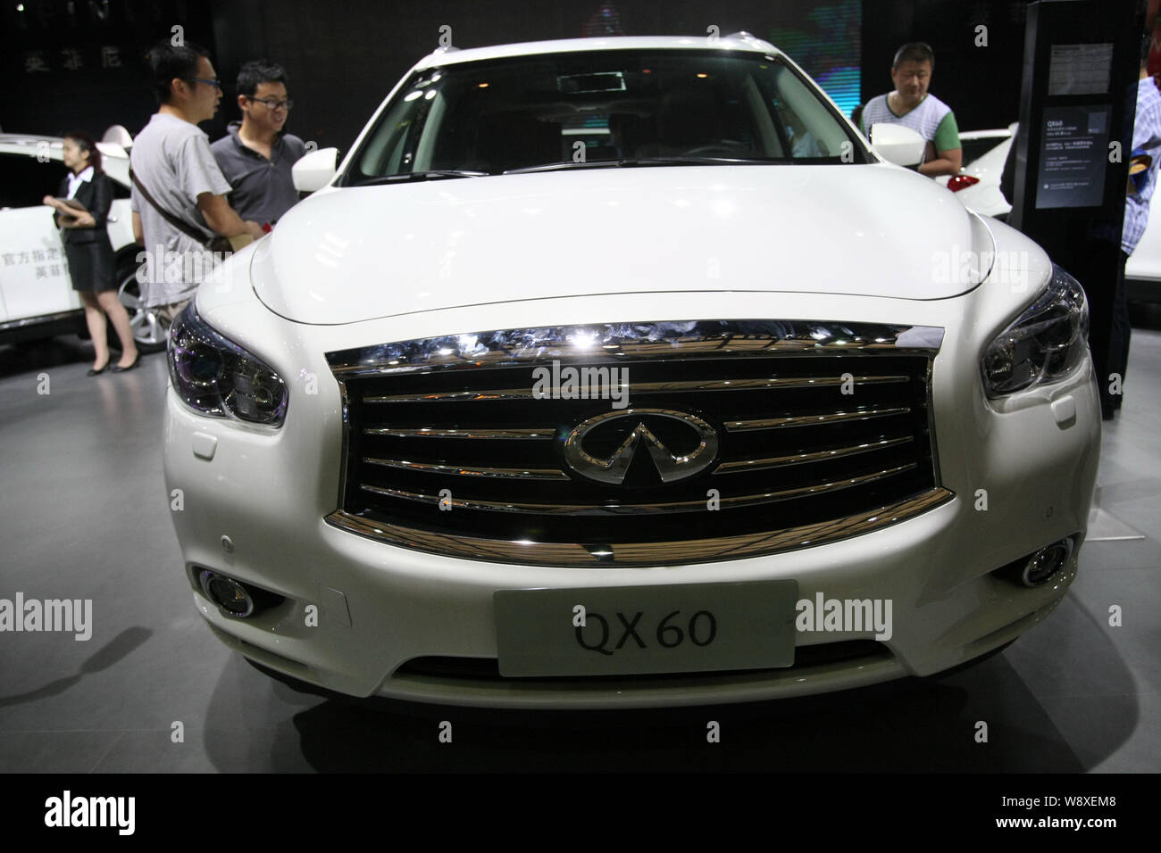 --FILE--Visitors look at a QX60 of Nissan Infiniti during the 2014 ...