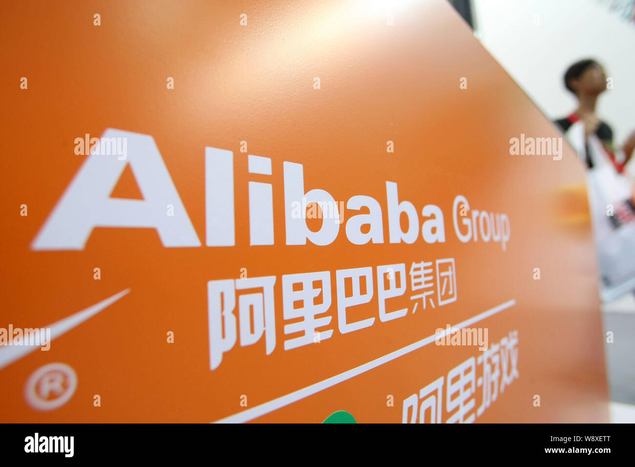 --FILE--A visitor walks past the stand of Chinese e-commerce giant ...