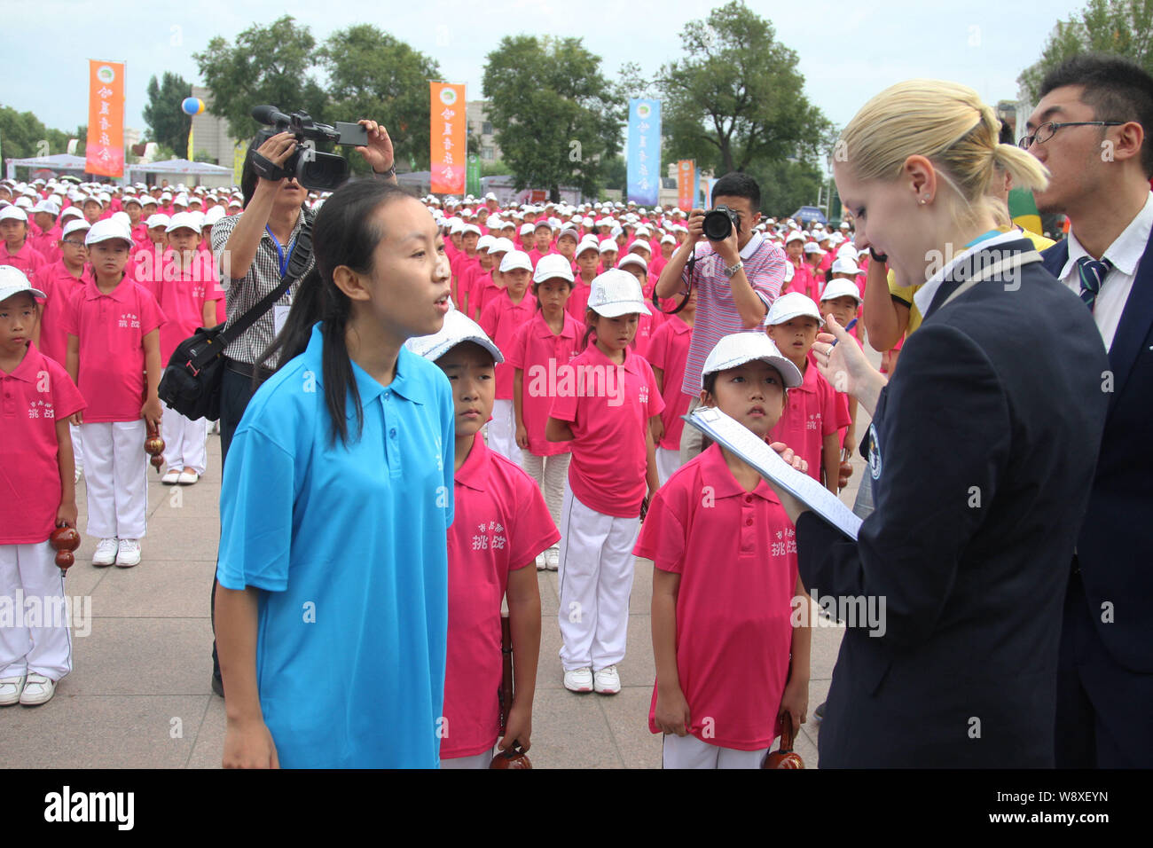 A staff member from the Guinness World Record committee, right ...