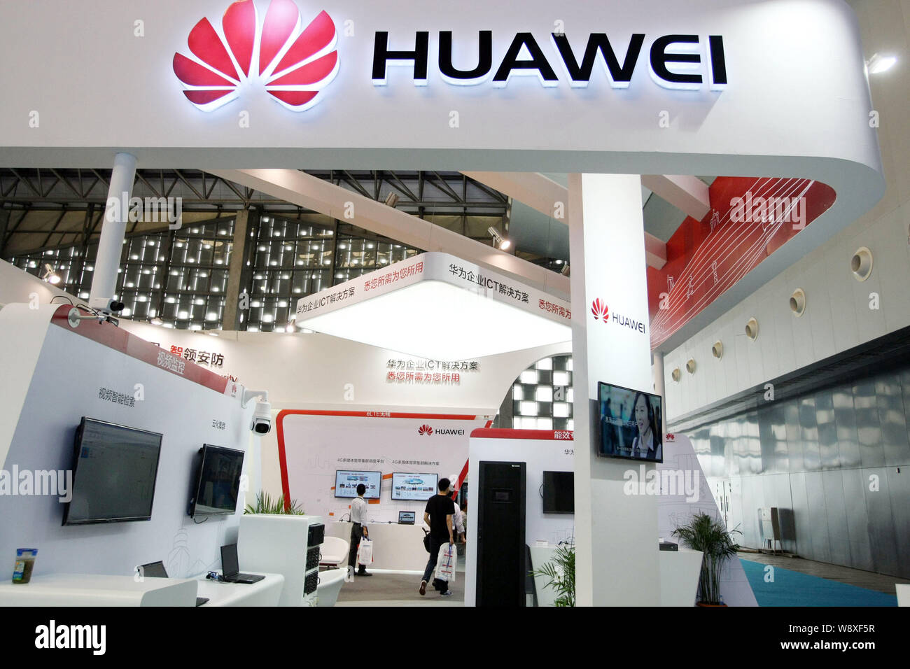 --FILE--People visit the stand of Huawei during an exhibition in ...