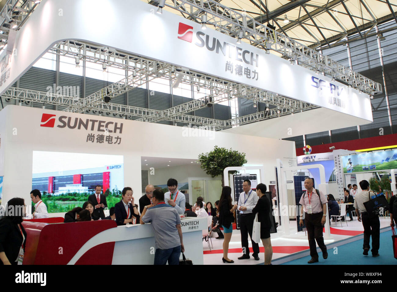 People visit the stand of Suntech during the SNEC (2014) International ...