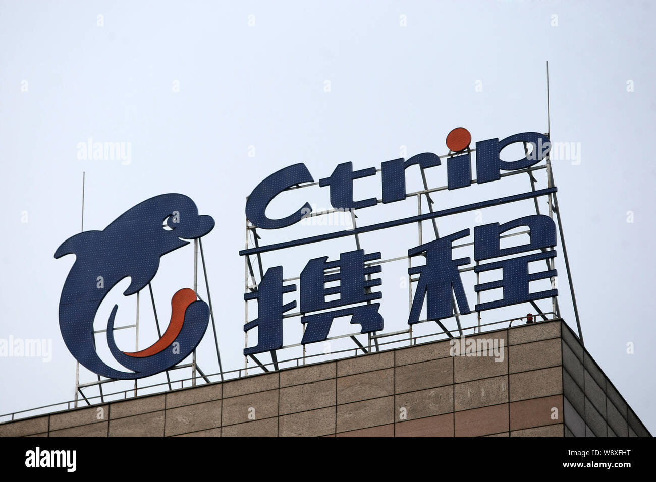 --FILE--A signboard of Ctrip is seen at the top of office building of ...