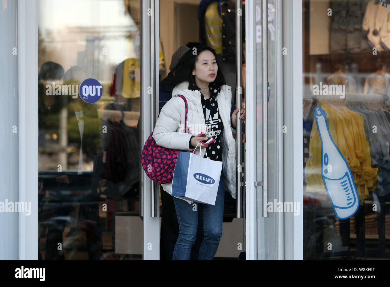 --FILE--A customer exits the flagship store of Old Navy of GAP in ...