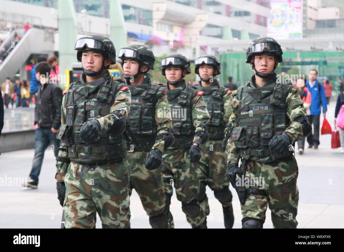 --FILE--Armed Chinese paramilitary policemen patrol a street in ...