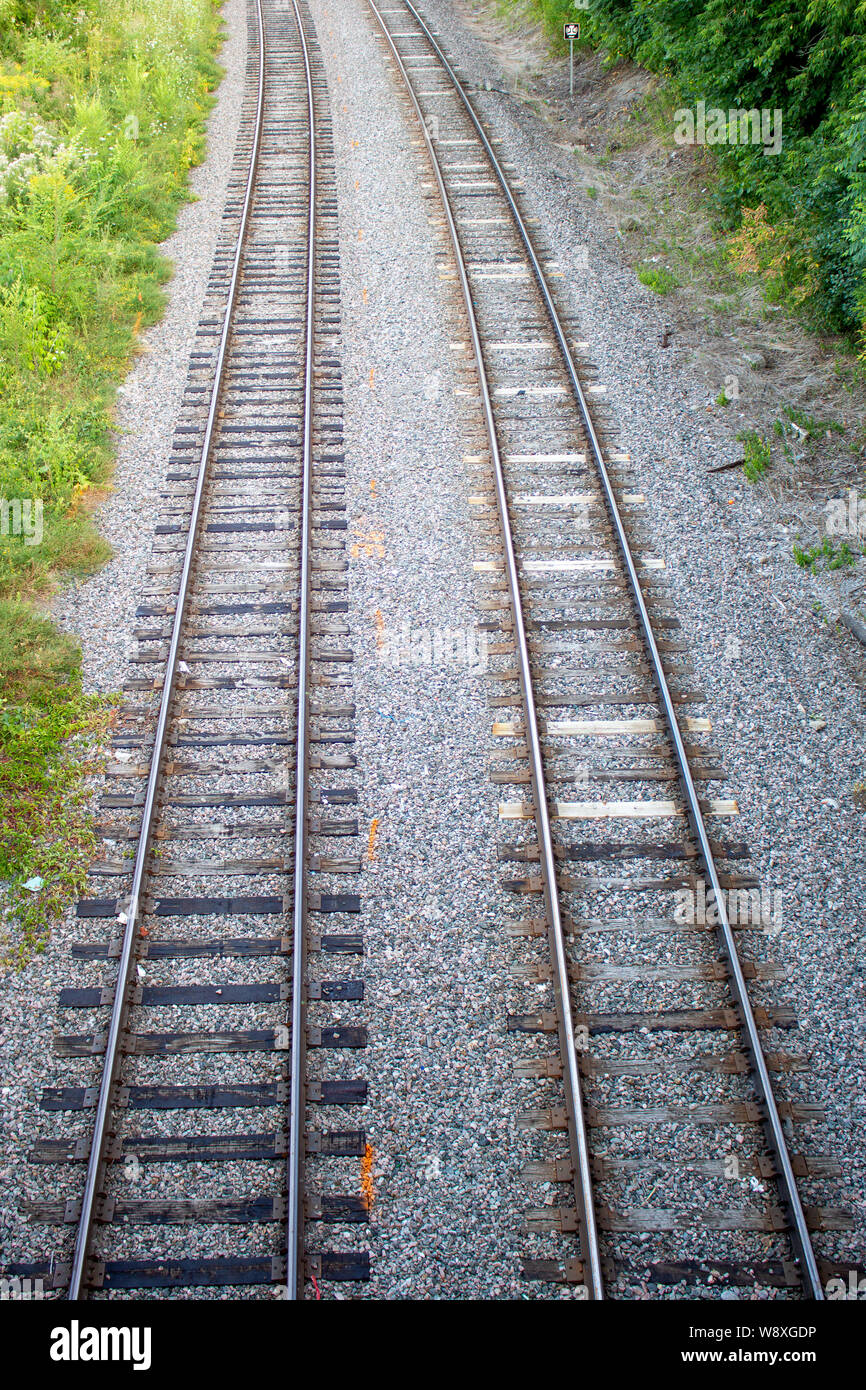 A pair of railway tracks for urban light rail move in parallel, curving ...