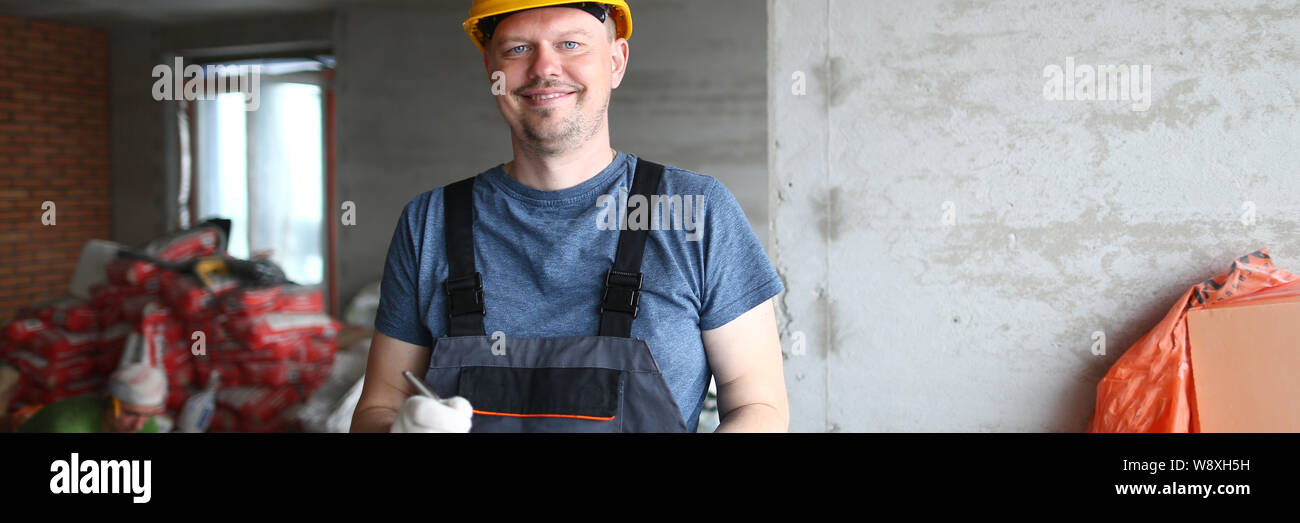 Smiling man posing in room Stock Photo - Alamy