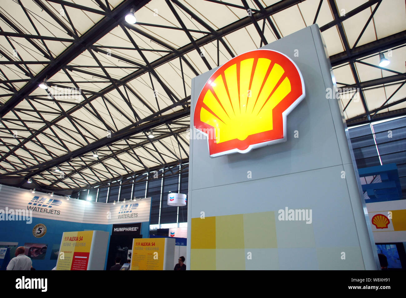 --FILE--People visit the stand of Shell during an exhibition in ...