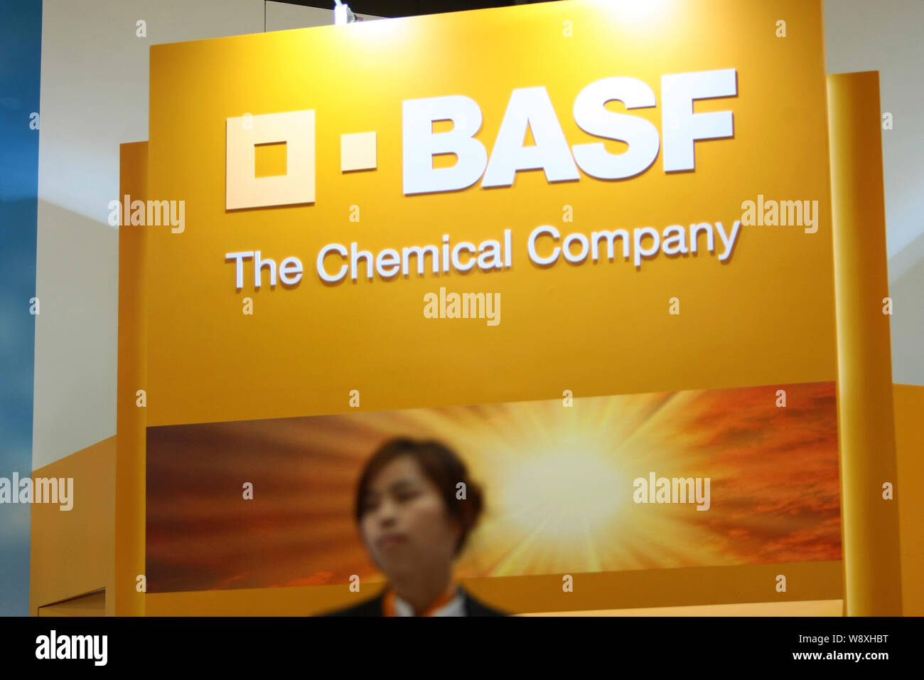 --FILE--An employee is seen at the stand of BASF during the 6th (2012 ...