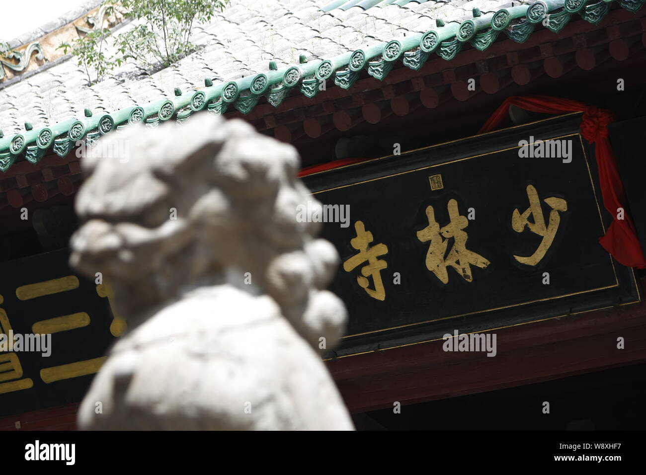 --FILE--View of a stone lion in front of the Shaolin Temple on the ...