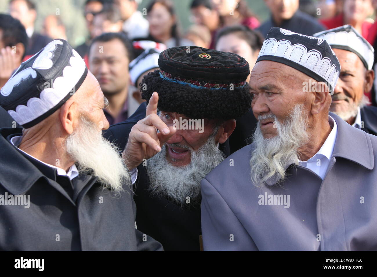 --FILE--Elderly men with beards talk during a festival in Zepu (Poskam ...