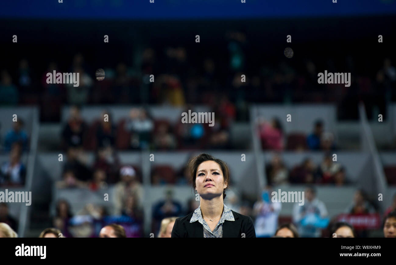 Chinese tennis player Li Na cries during her retirement ceremony at the ...