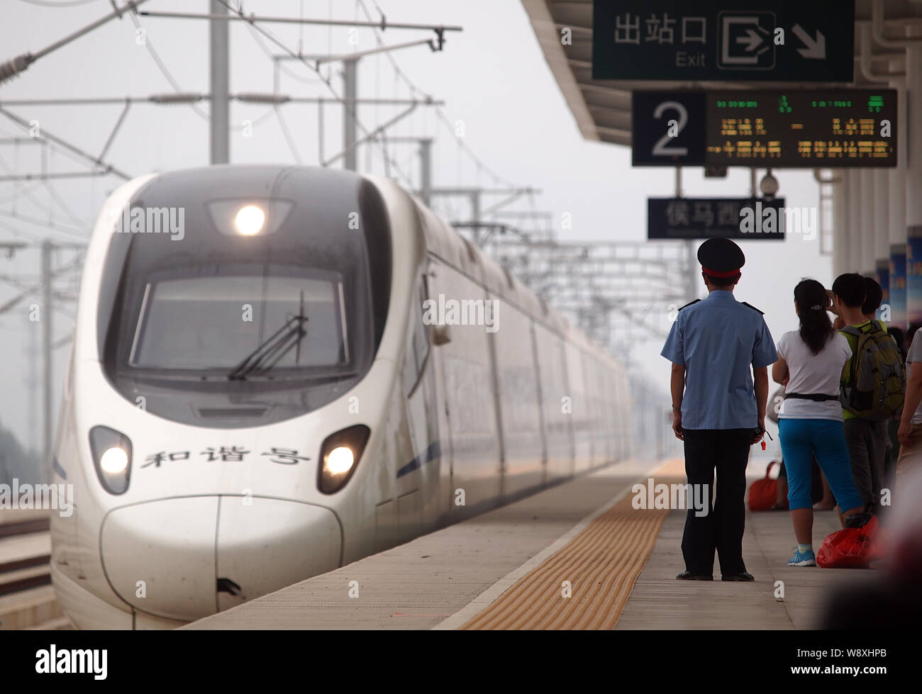 --FILE--A CRH (China Railway High-speed) train arrives at the Houma ...