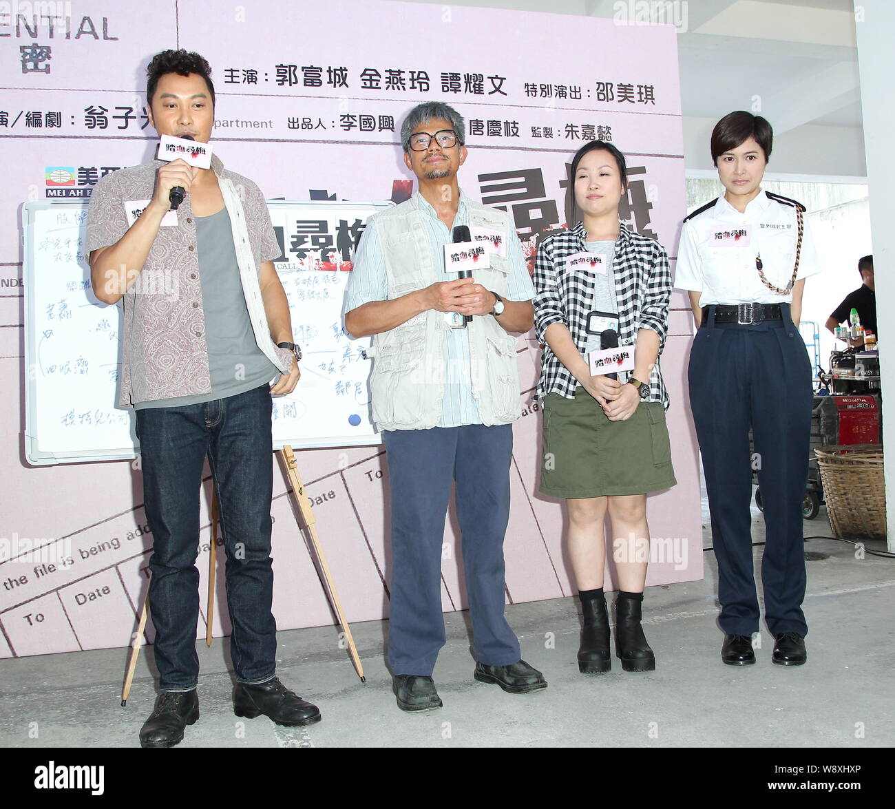 Hong Kong singers and actors Patrick Tam, left, and Aaron Kwok, second ...