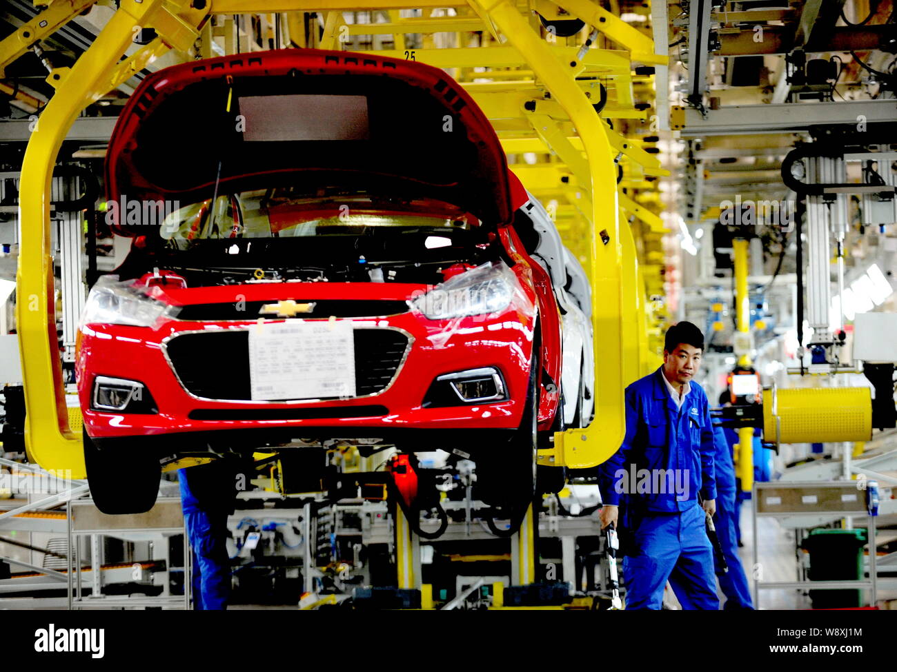 --FILE--Chinese workers assemble Chevrolet cars on the assembly line at ...