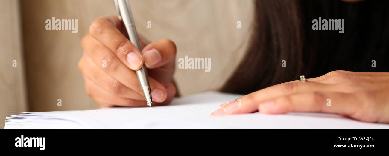 Arm of black woman write story in notebook Stock Photo - Alamy