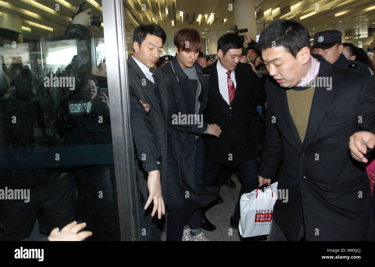 South Korean actor Lee Min-ho, center, is surrounded by crowds of fans ...