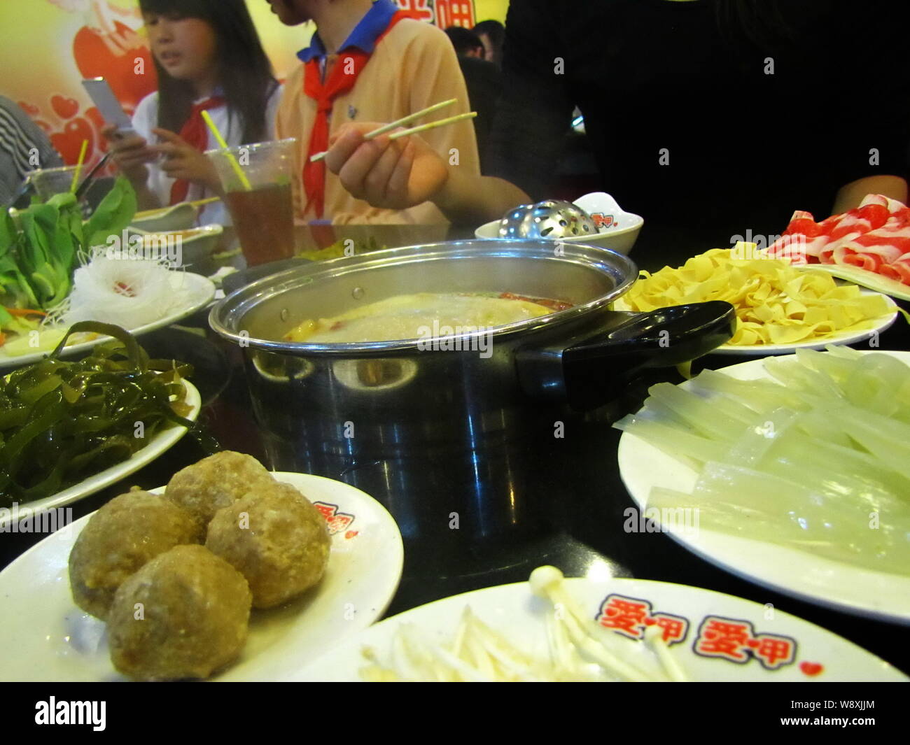 --FILE--Customers eat hotpot at a hot-pot restaurant in Shanghai, China ...