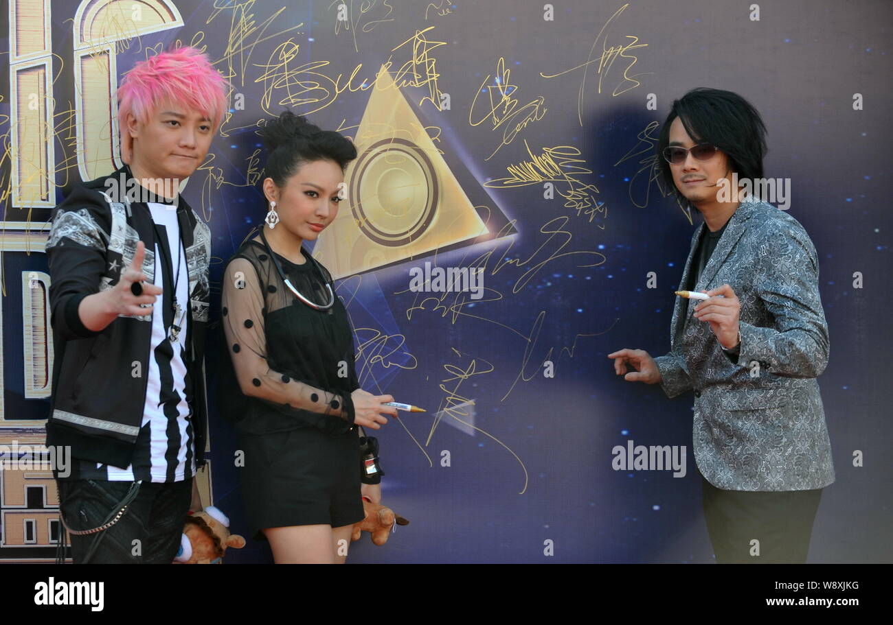 Members of Taiwanese band F.I.R. pose on the red carpet as they arrive ...