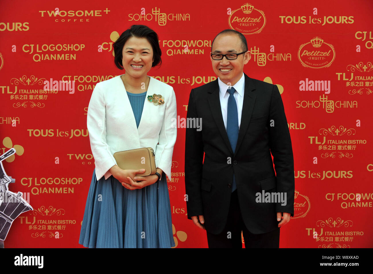 --FILE--Zhang Xin, left, co-founder and co-CEO of SOHO China, and her husband Pan Shiyi, co ...