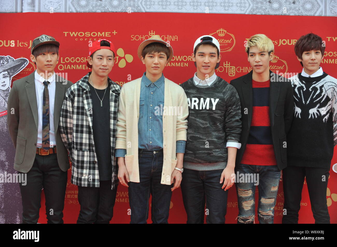 Members of Chinese-Korean pop group TIMEZ pose as they arrive for the ...