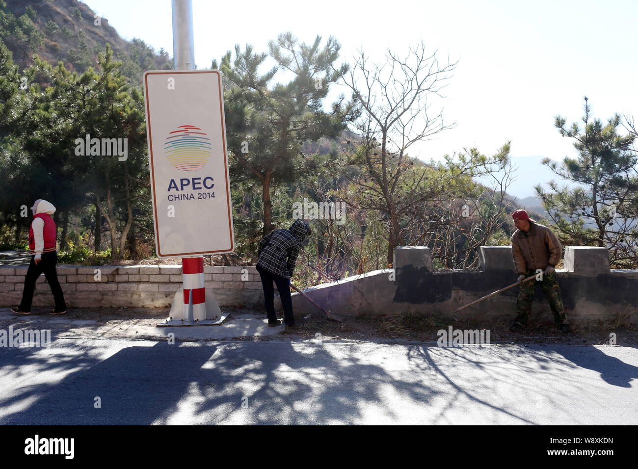 Local Chinese villagers clean the China National Highway 111 for the ...