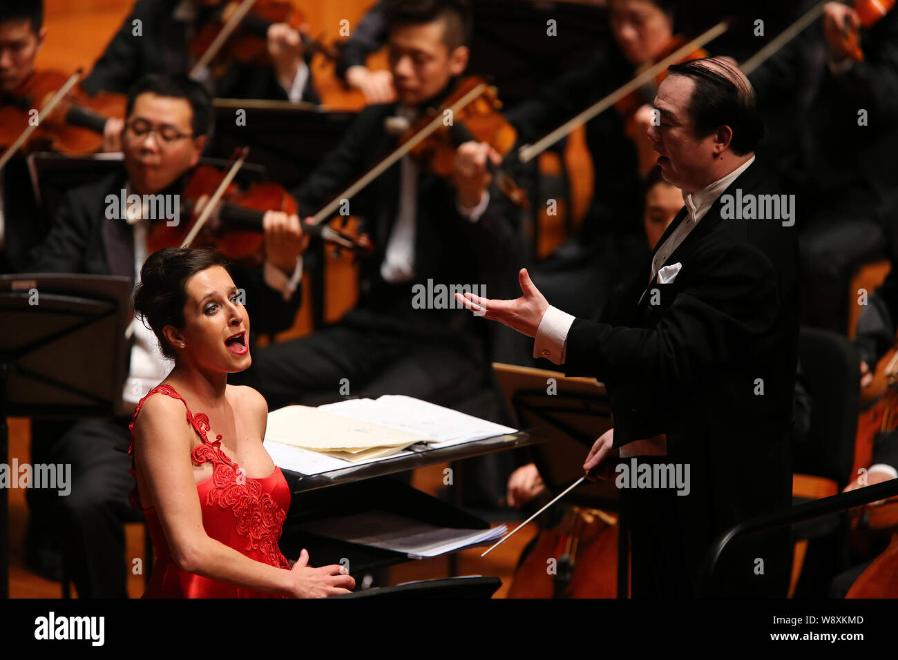 French soprano Julie Cherrier, front left, and Chinese conductor Yu ...