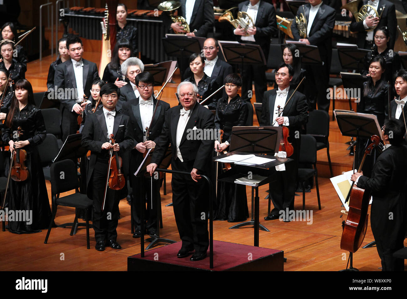 French conductor Philippe Entremont, front center, and band members ...