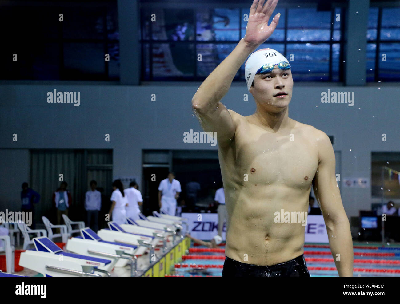 --FILE--Sun Yang of China waves after the 1500m freestyle final during ...
