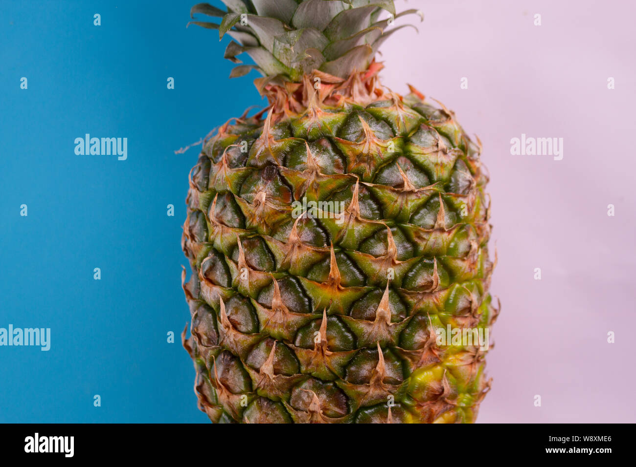 pineapple close up on the blue background Stock Photo - Alamy