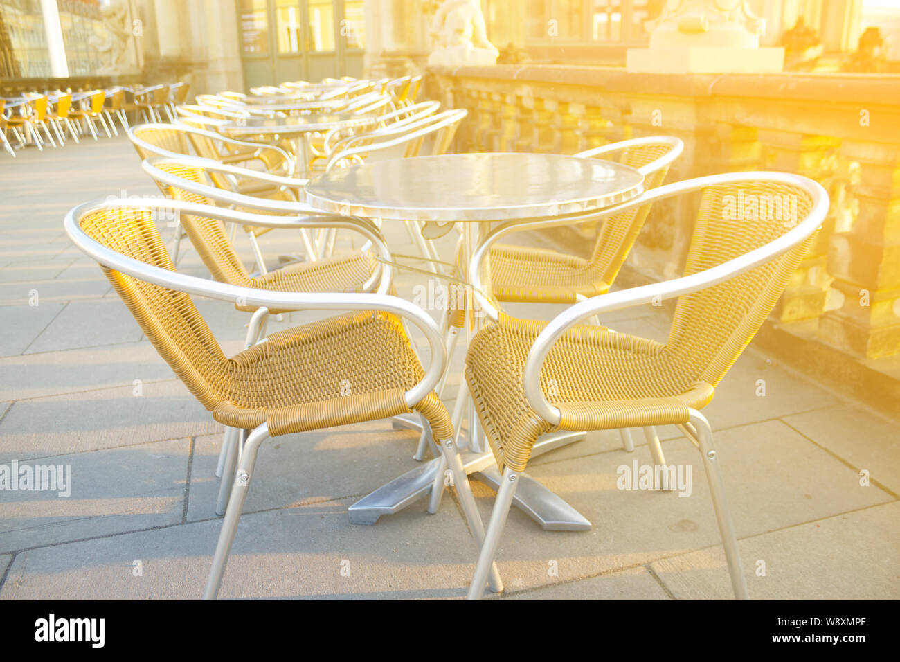 Street cafe with brown tables and chairs Stock Photo - Alamy