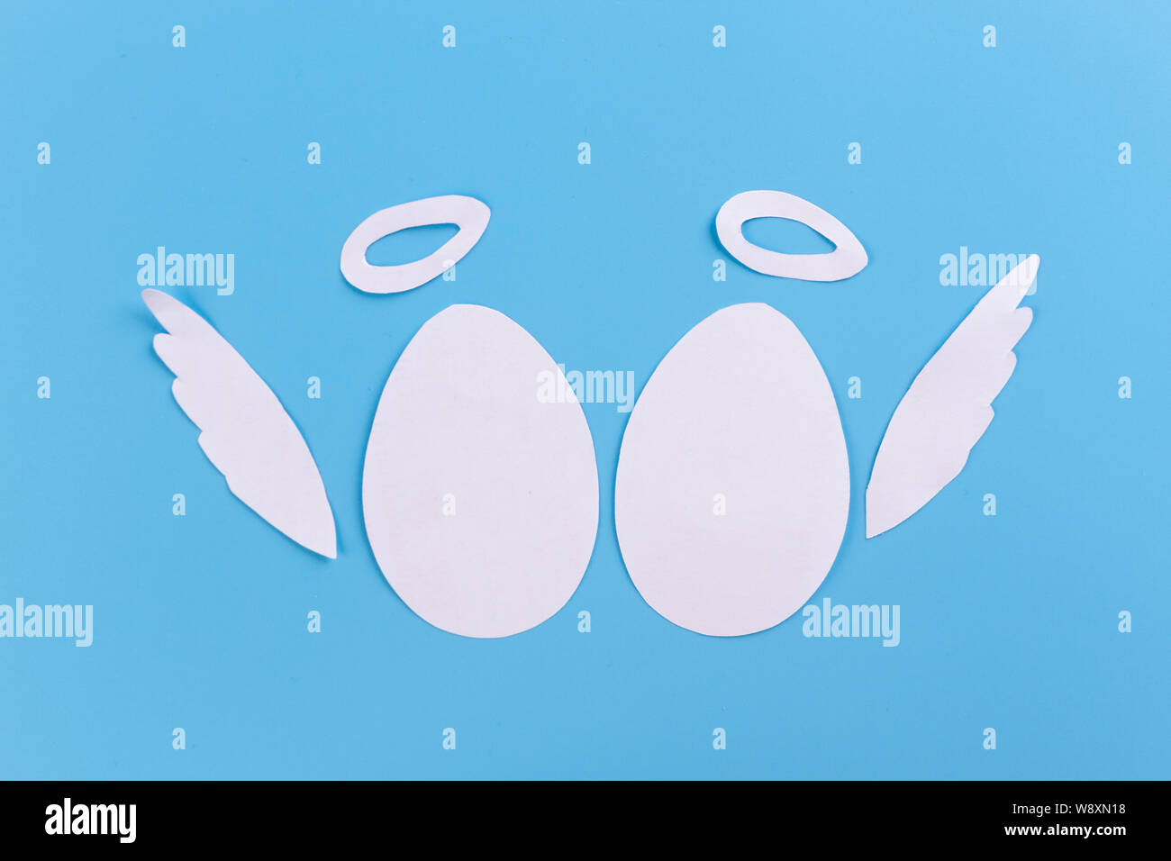Eggs on blue background with copy space Stock Photo - Alamy