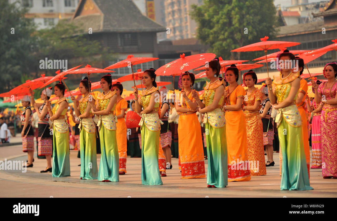 Chinese performers dressed in traditional costumes of Dai ethnic ...