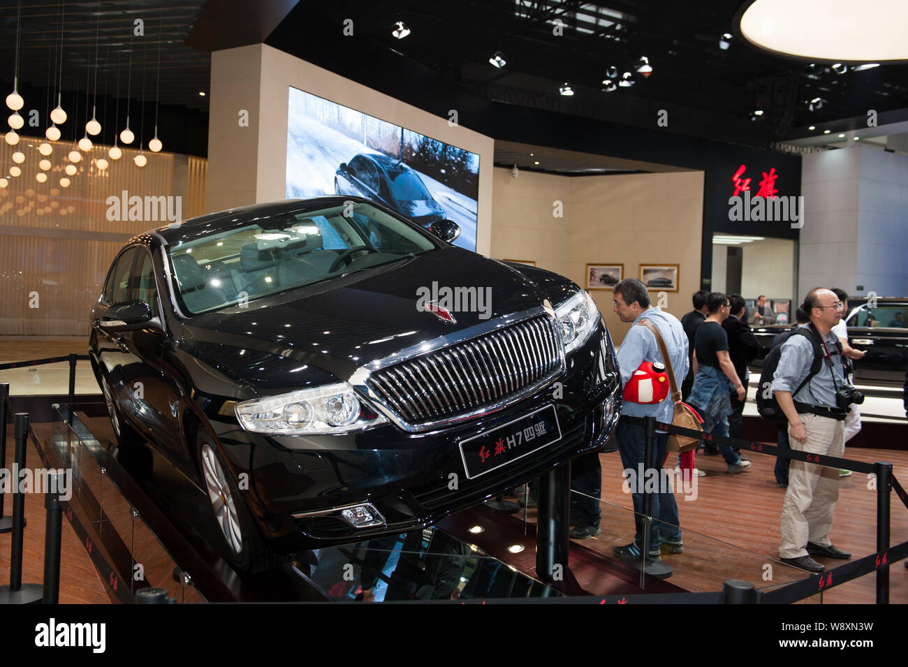 --FILE--Visitors look at a Hongqi (Red Flag) H7 of FAW during the 13th ...