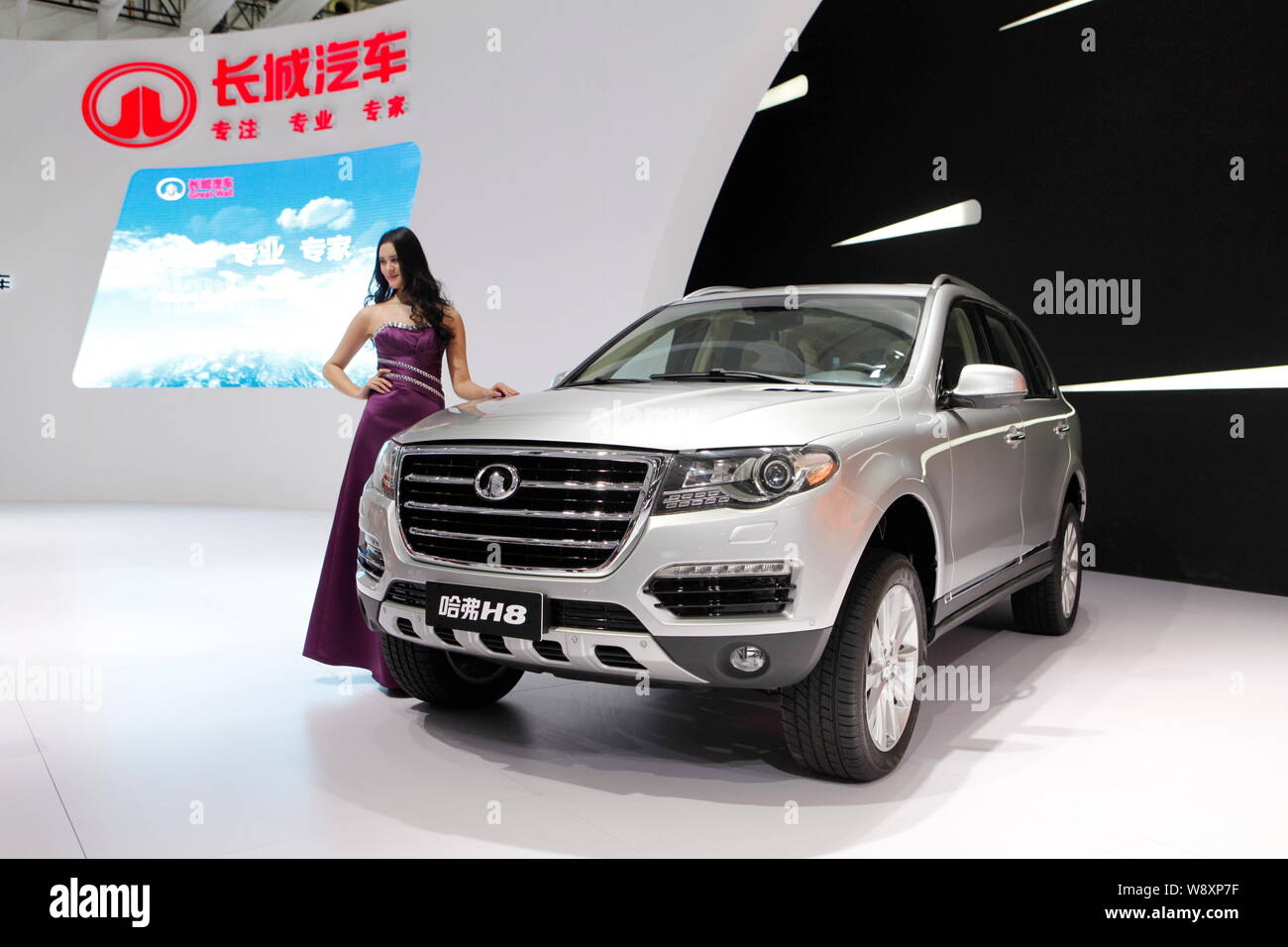 --FILE--A model poses with a Haval H8 SUV of Great Wall Motors during ...