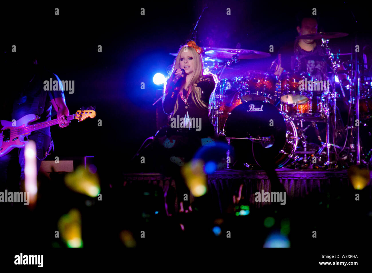 Canadian singer Avril Lavigne, center, performs during her World Tour ...