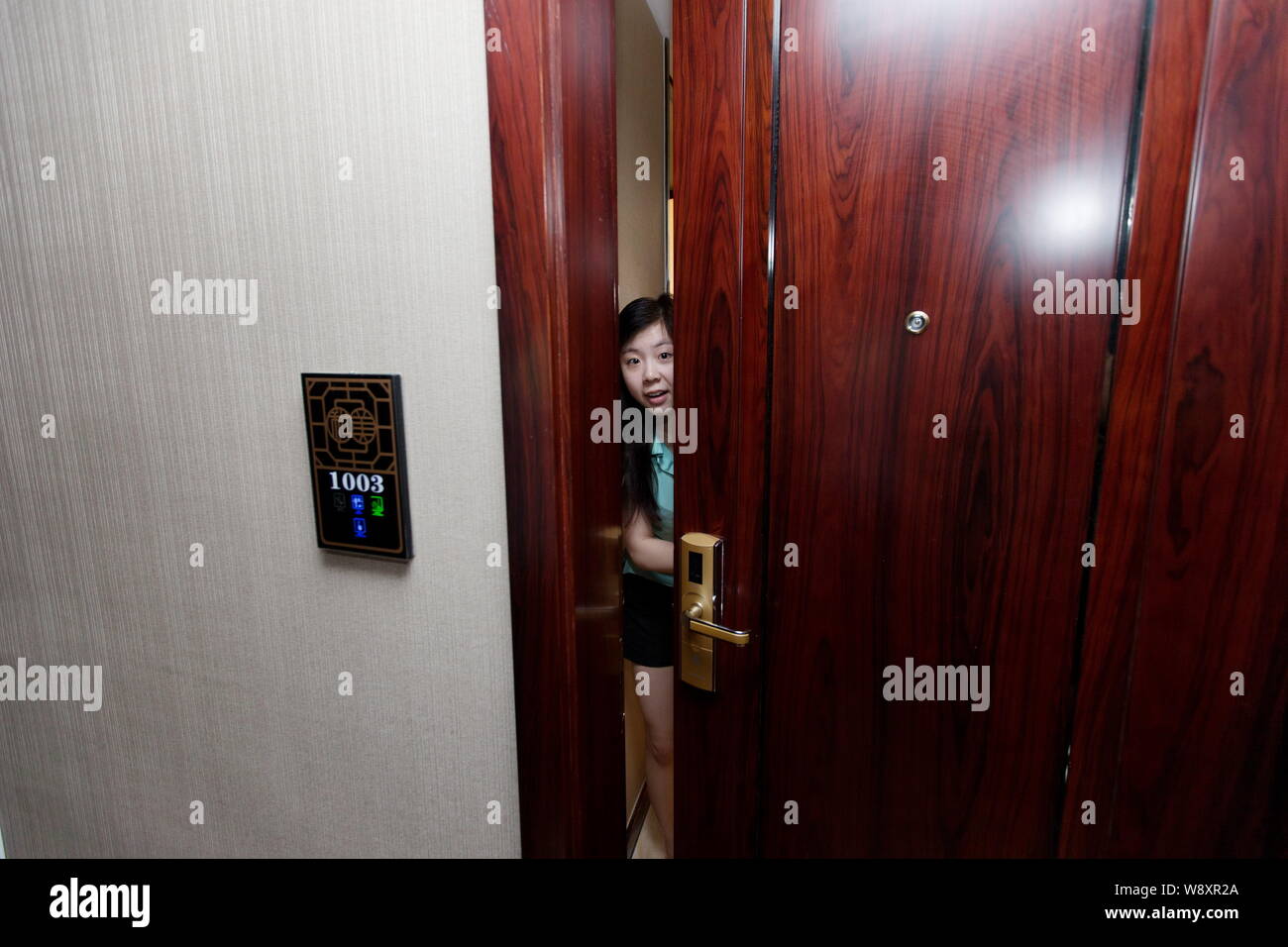 American table tennis player Ariel Hsing opens the door of her room at ...