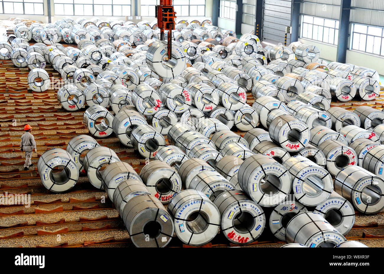 --FILE--Rolls of coiled steel plates are store at the warehouse of a ...
