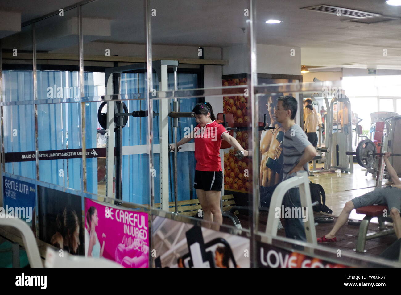 Head coach Si Hai of Jinhua Bank team, right, directs American table ...
