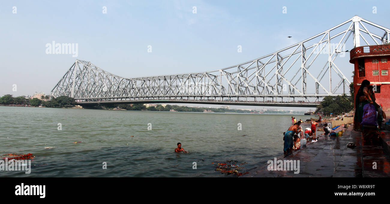 People bathing at a ghat, Howrah Bridge, Hooghly River, Kolkata, West ...