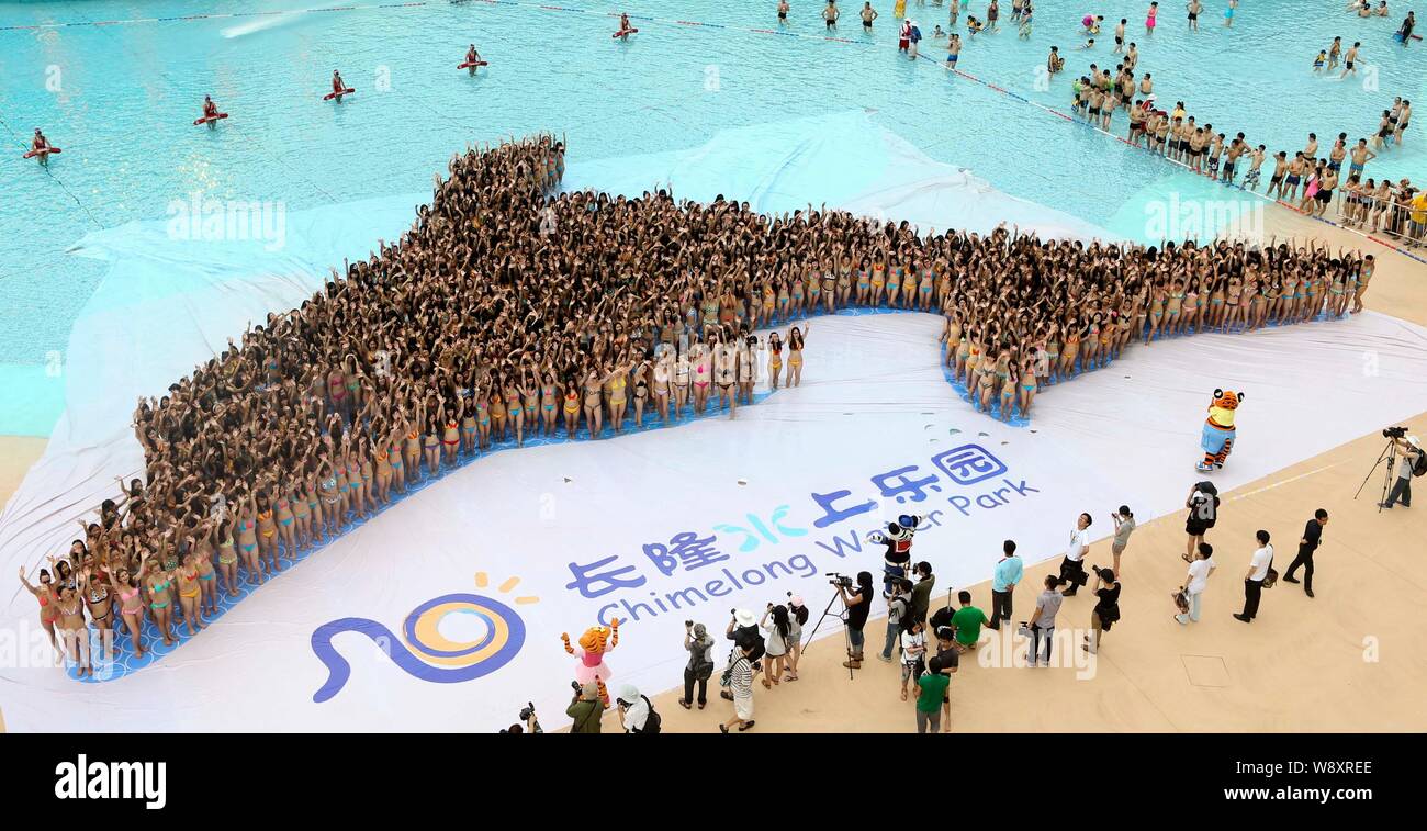 Girls Wearing Bikinis Form A Dolphin Like Shape To Celebrate Summer At Chimelong Water Park In