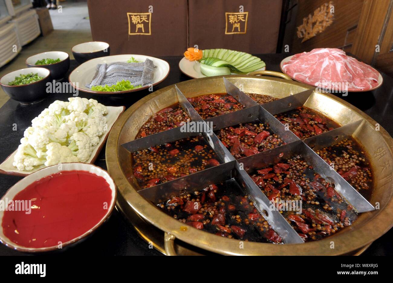 --FILE--A spicy hotpot is served at a hot-pot restaurant in Beijing ...