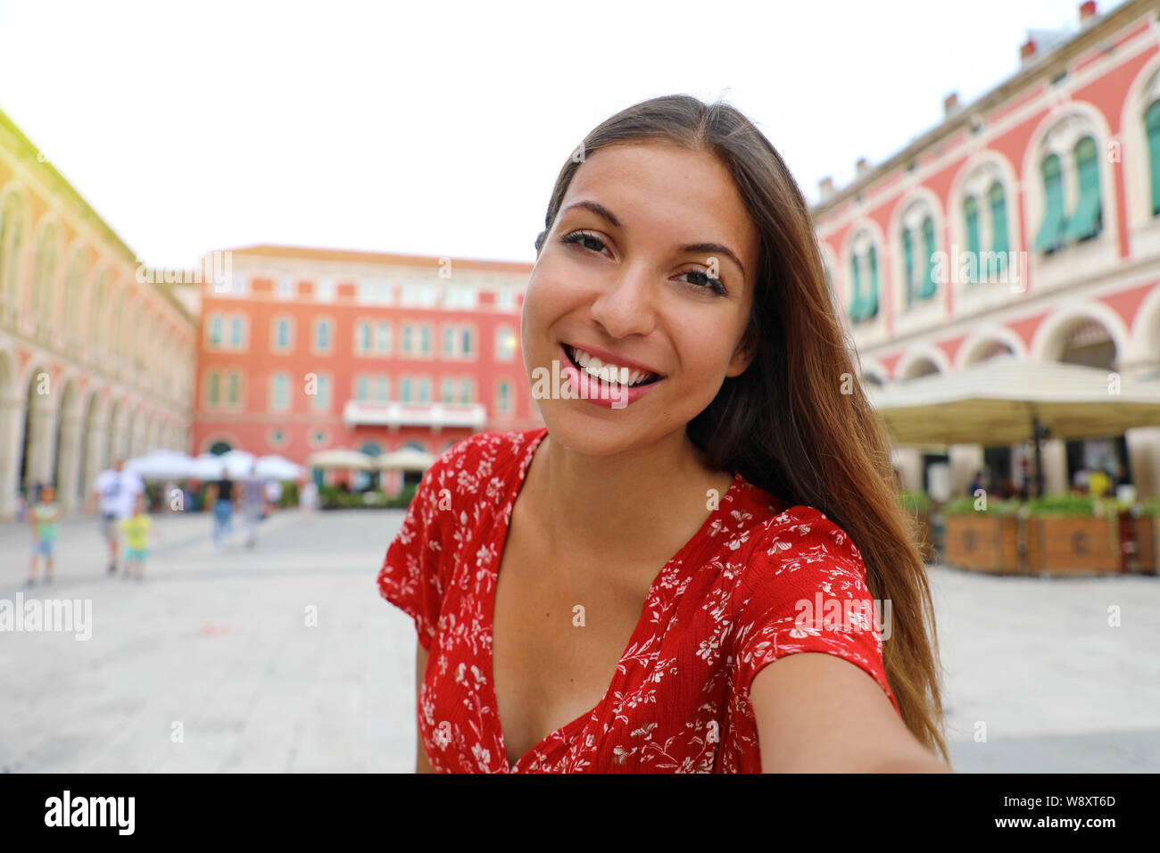 Beautiful young woman take self portrait in Republic square at Split ...