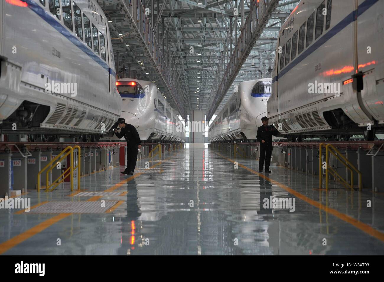Chinese technicians examine CRH (China Railway High-speed) bullet ...