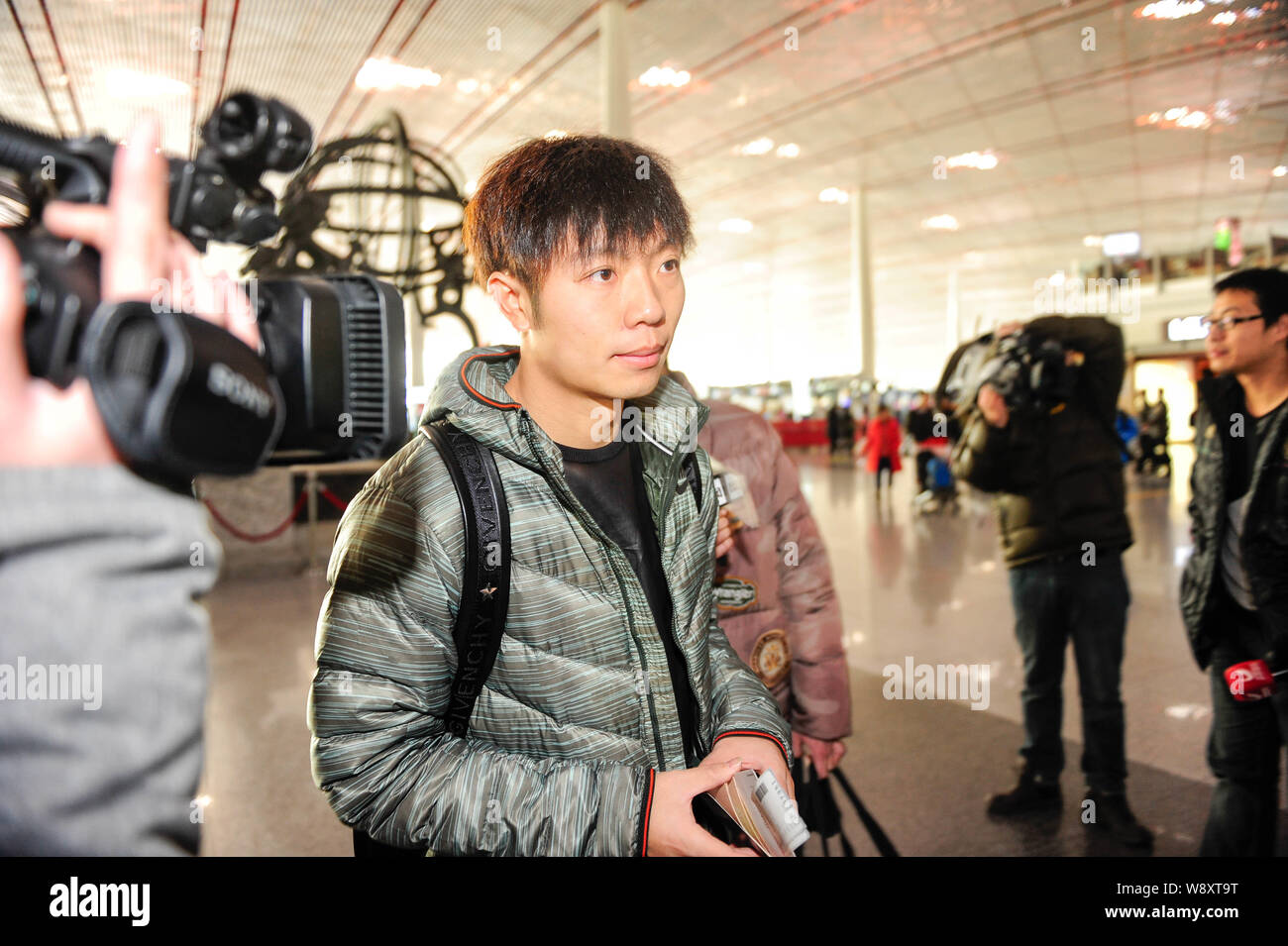 Chinese footballer Zhang Xizhe arrives at the Beijing Capital ...