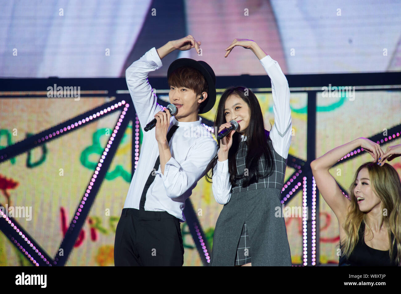 Chinese singers Zhou Mi, left, and Victoria Song Qian perform at the ...