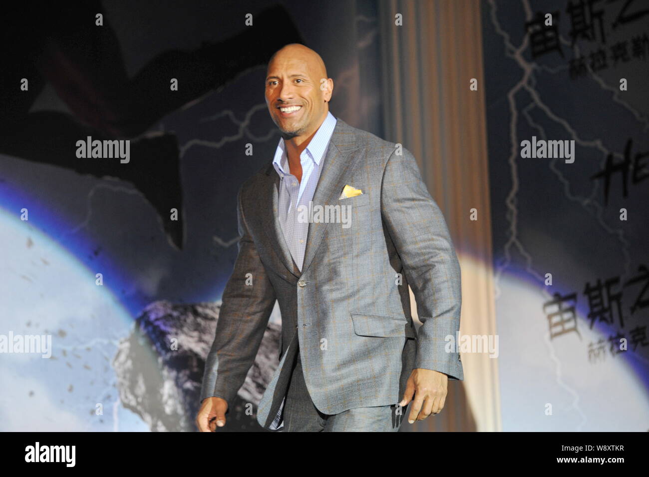 American actor Dwayne Johnson smiles as he arrives for a press ...